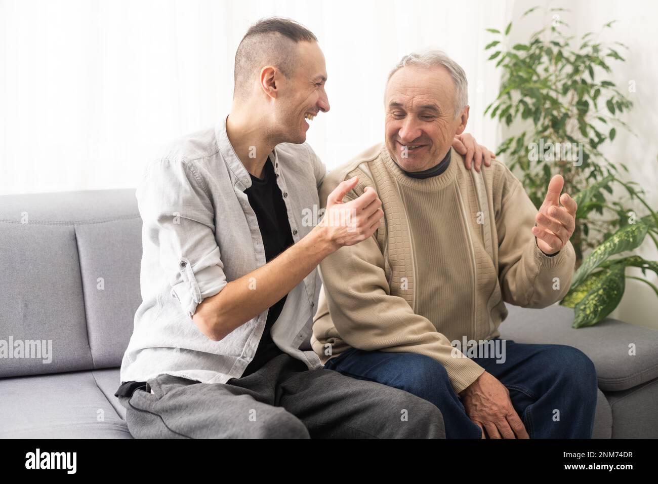 Happy two generations male family old senior mature father and smiling ...
