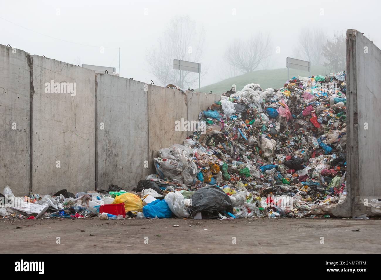 Landfill site, a pile of stinky different junk disposal in the concrete ...