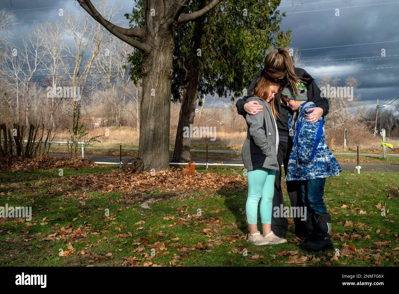 Vanessa LaBrie holds onto her two children, Kiersteyn Fields, 10, and ...