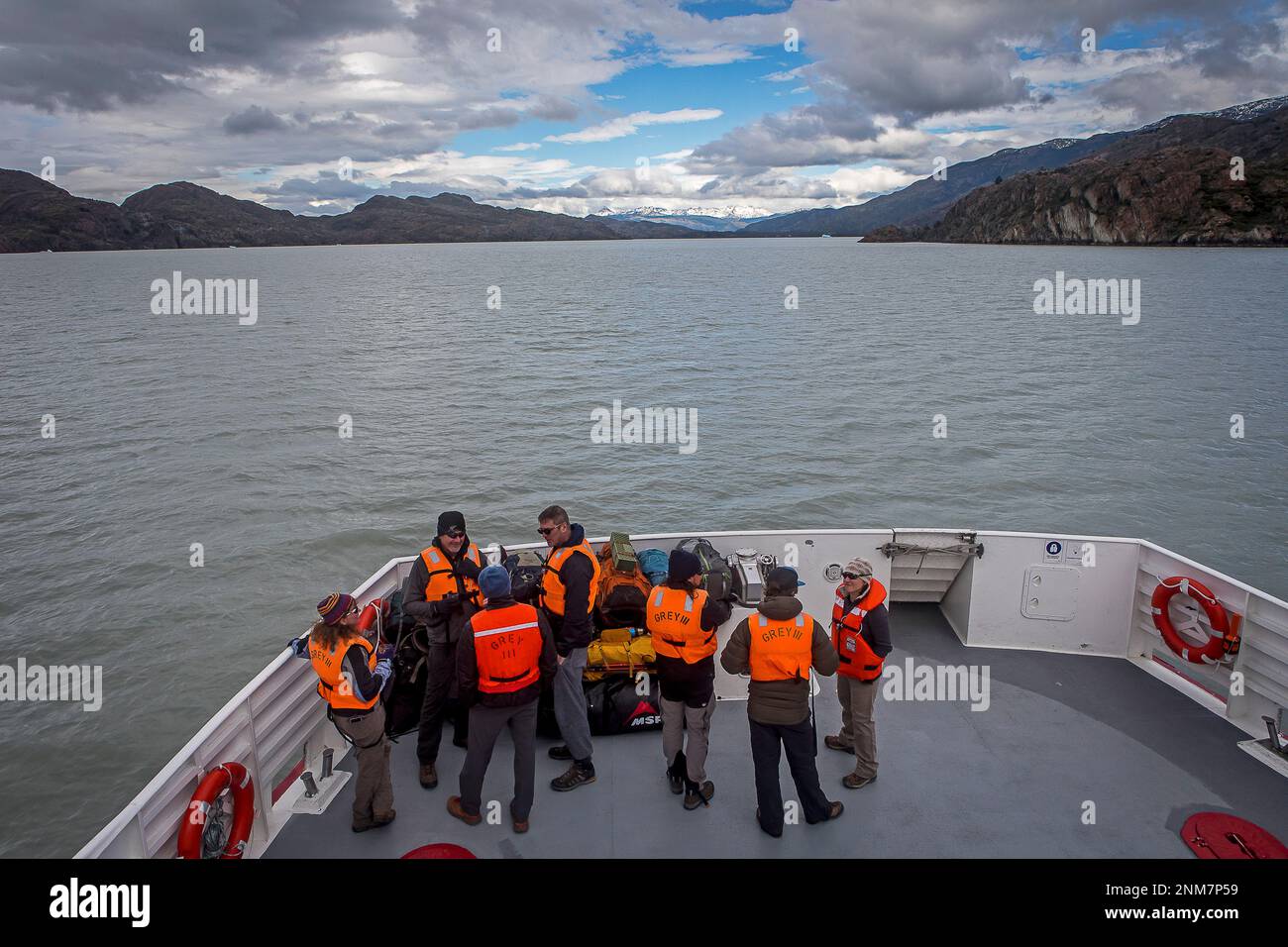 Hikers in a Catamaran, crossing Grey lake between Refugio Grey and ...