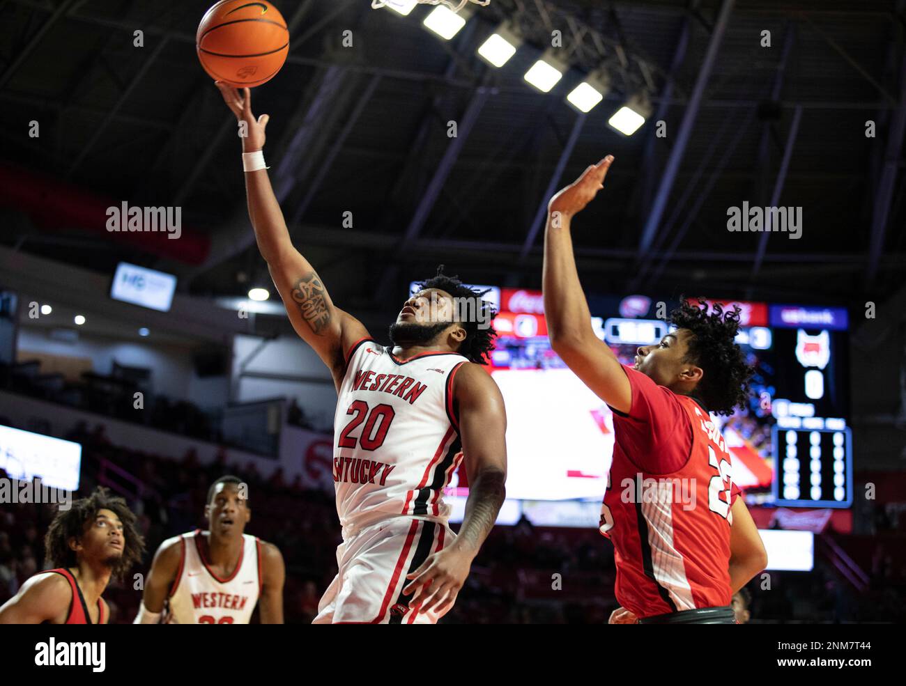 Western Kentucky guard Dayvion McKnight shoots a layup against Rhodes ...