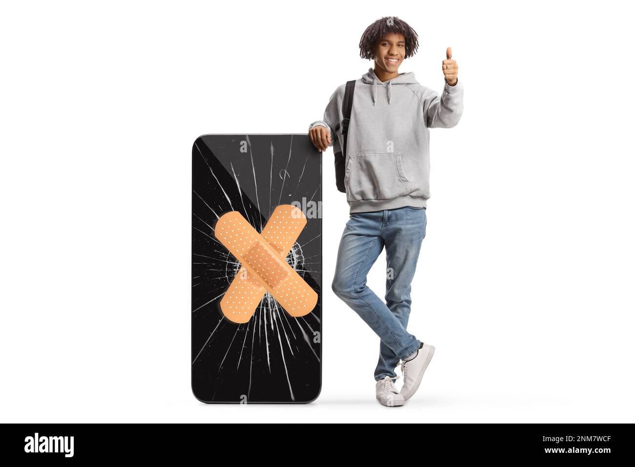 Young african american man leaning on a big mobile phone with cracked ...