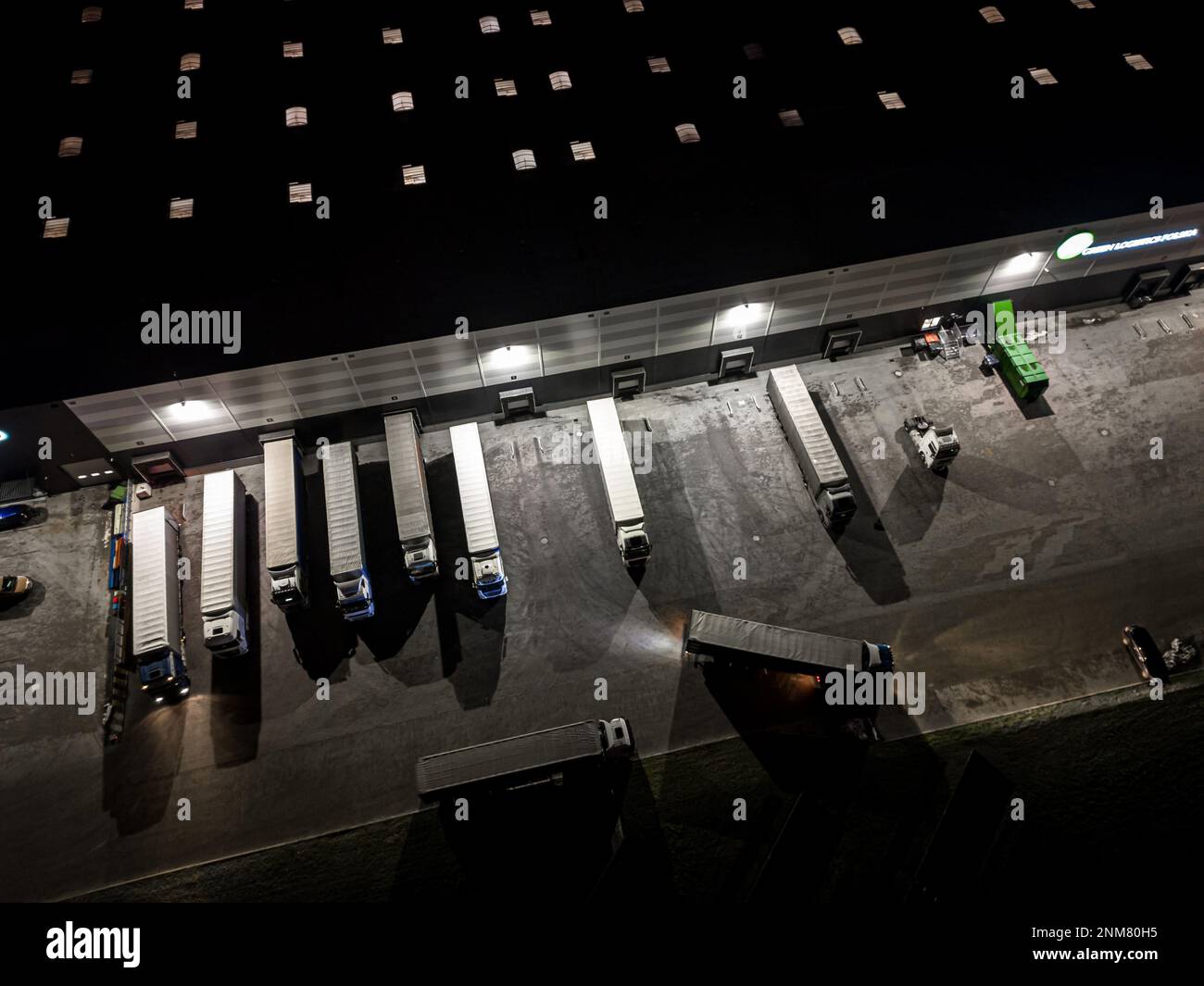 Night Aerial view of goods warehouse. Logistics center in industrial ...