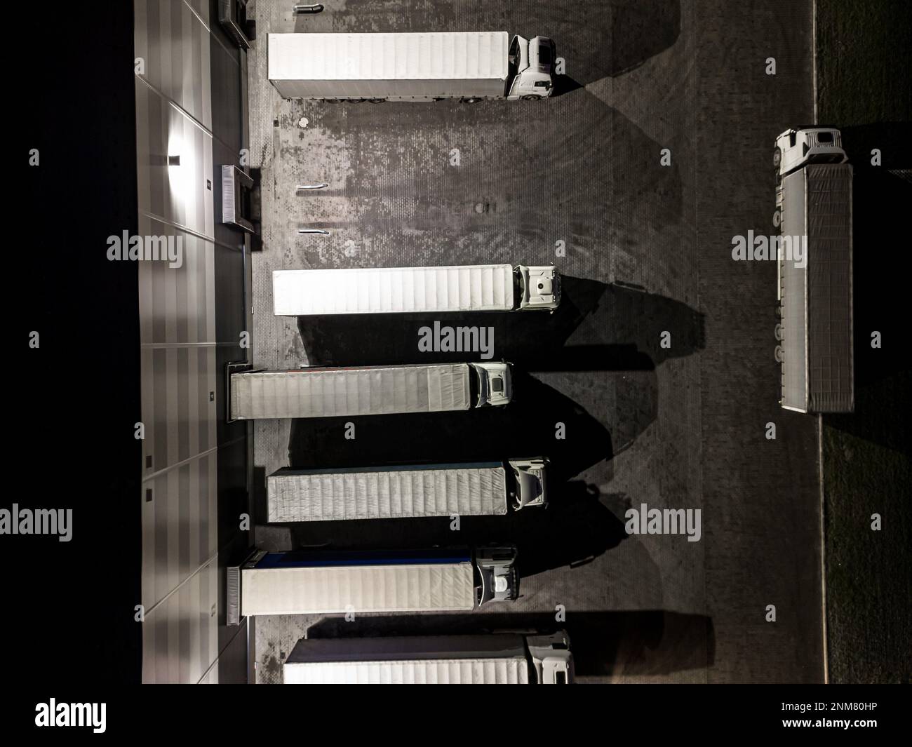 Aerial view of goods warehouse night. Logistics delivery; center in ...