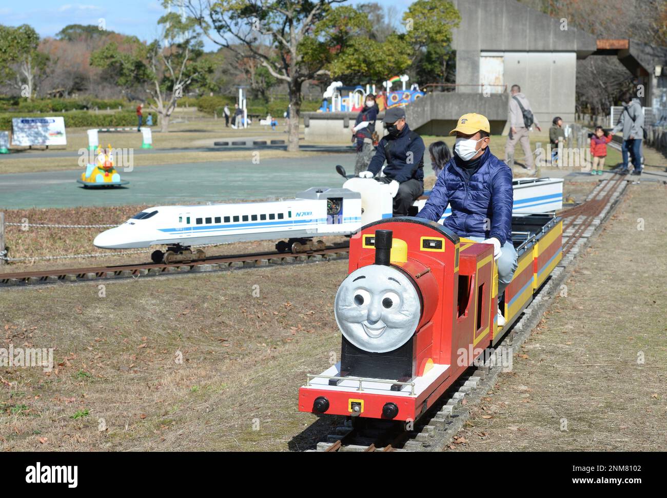 Visitors ride mini-SL (Steam Locomotive) and shinkansen bullet train at ...
