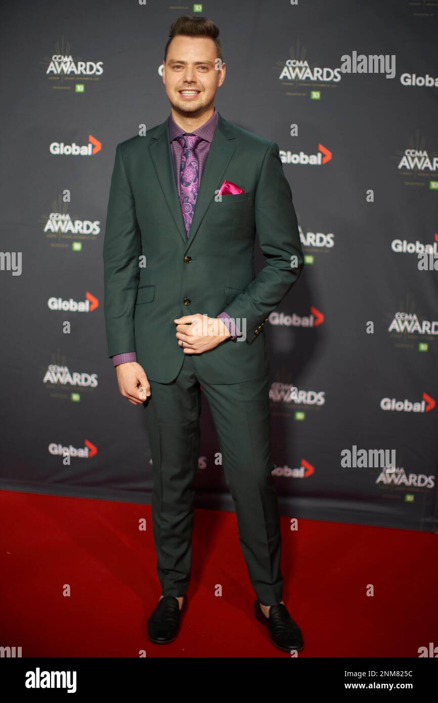 Ty Hunter poses for photographers on the red carpet at the Canadian ...