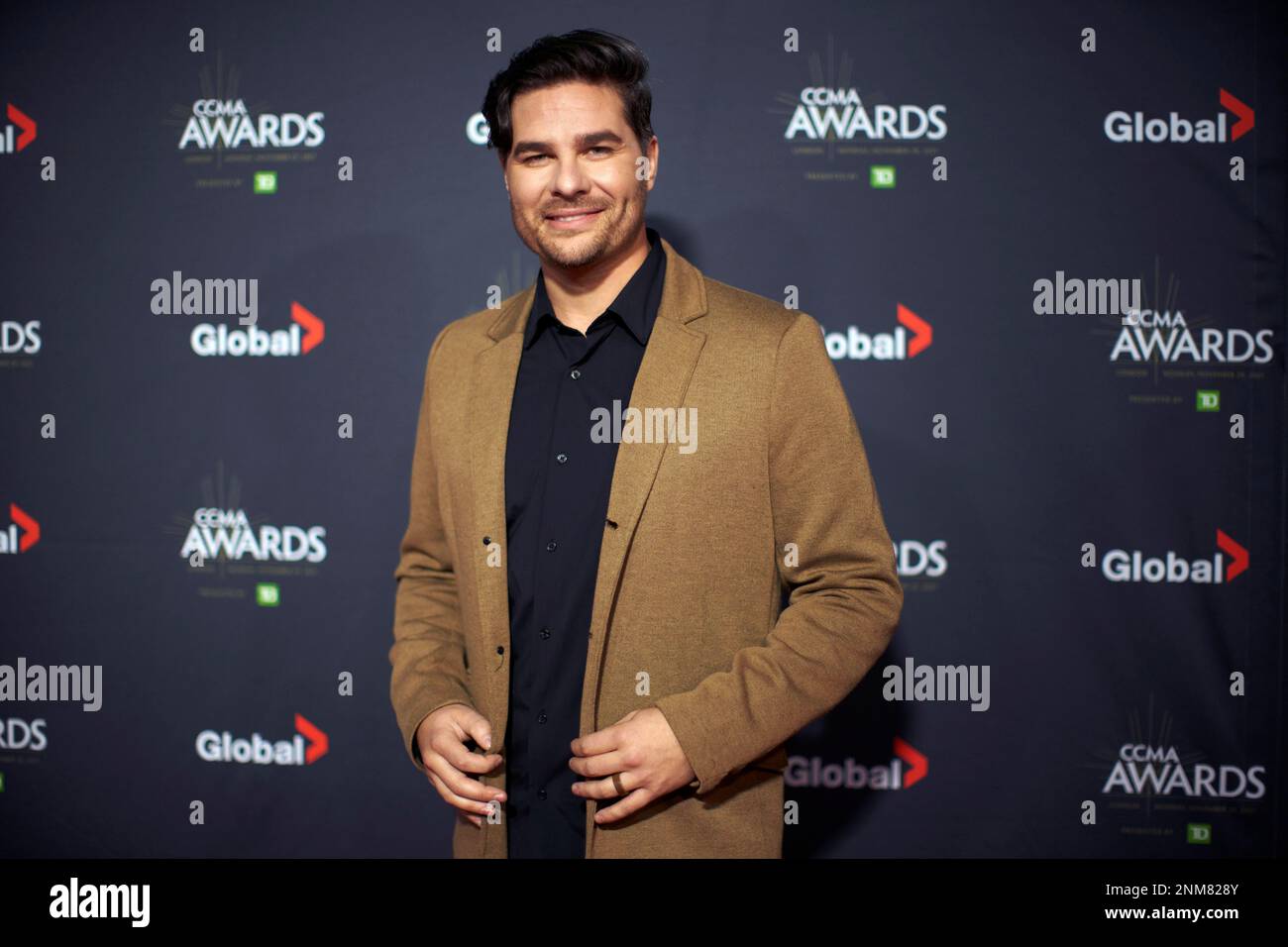 Steven Lee Olsen poses for photographers on the red carpet at the ...