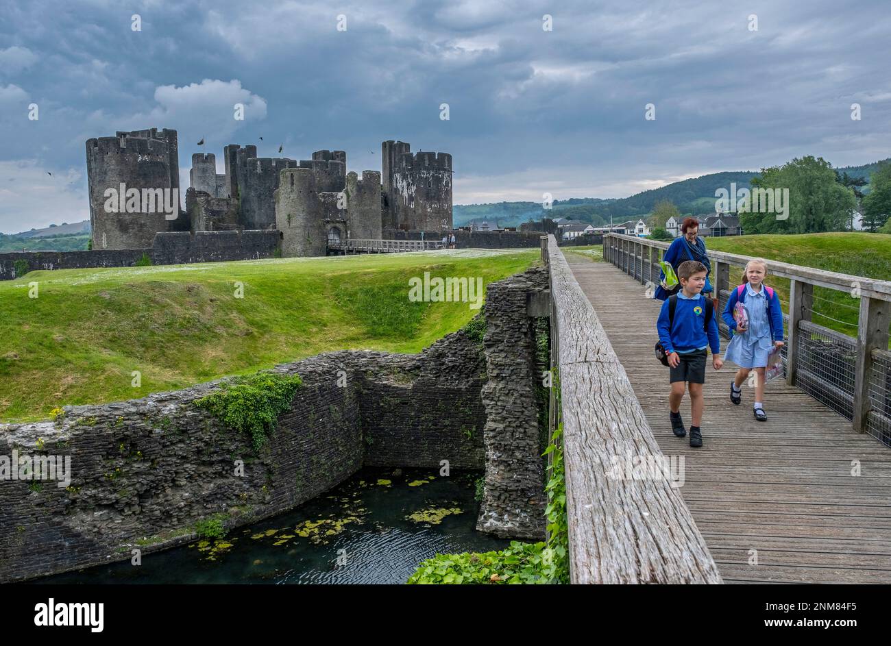 Street scene, in background Caerphilly castle, wales Stock Photo - Alamy