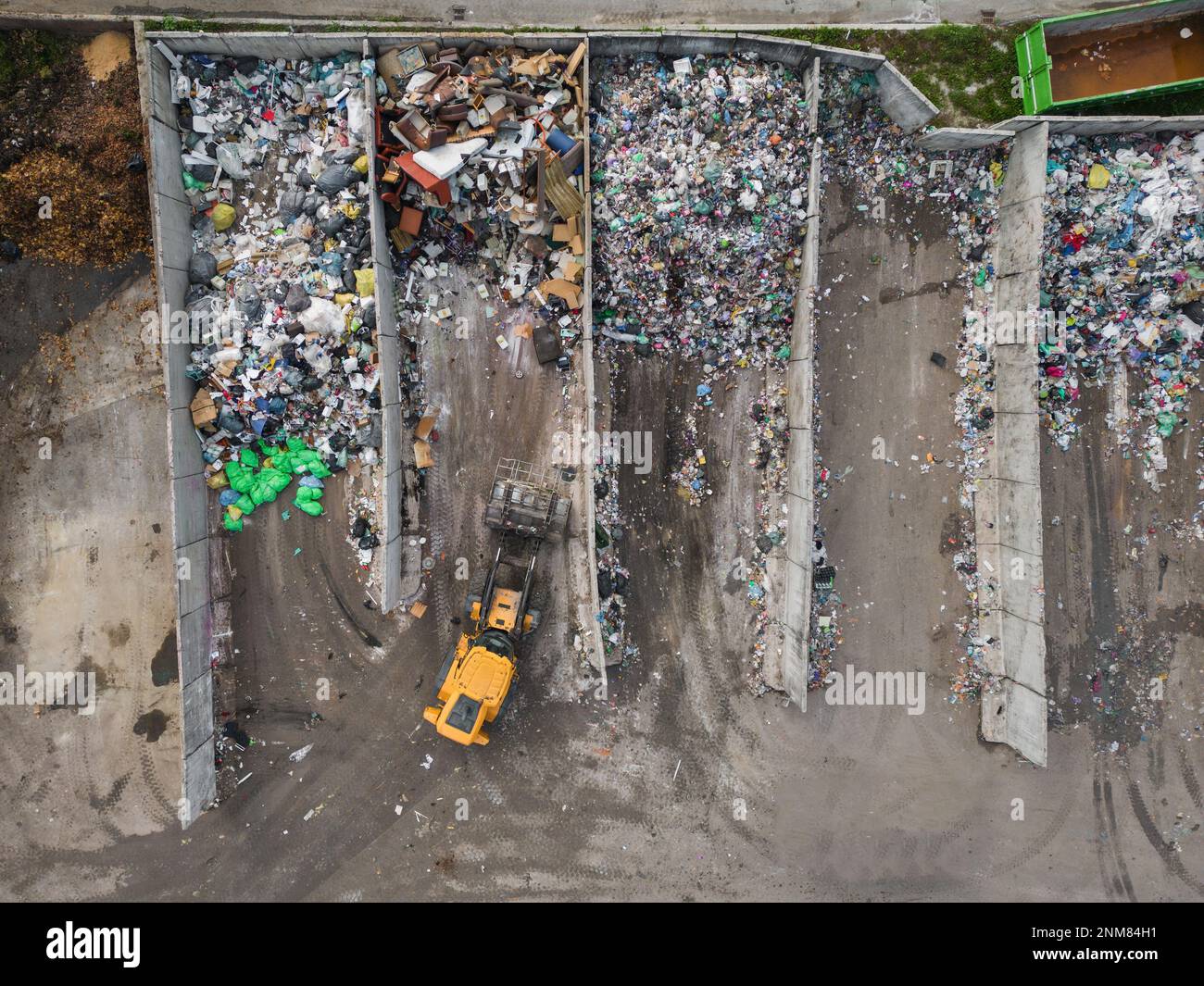 Landfill site, a pile of stinky different junk disposal in the concrete ...
