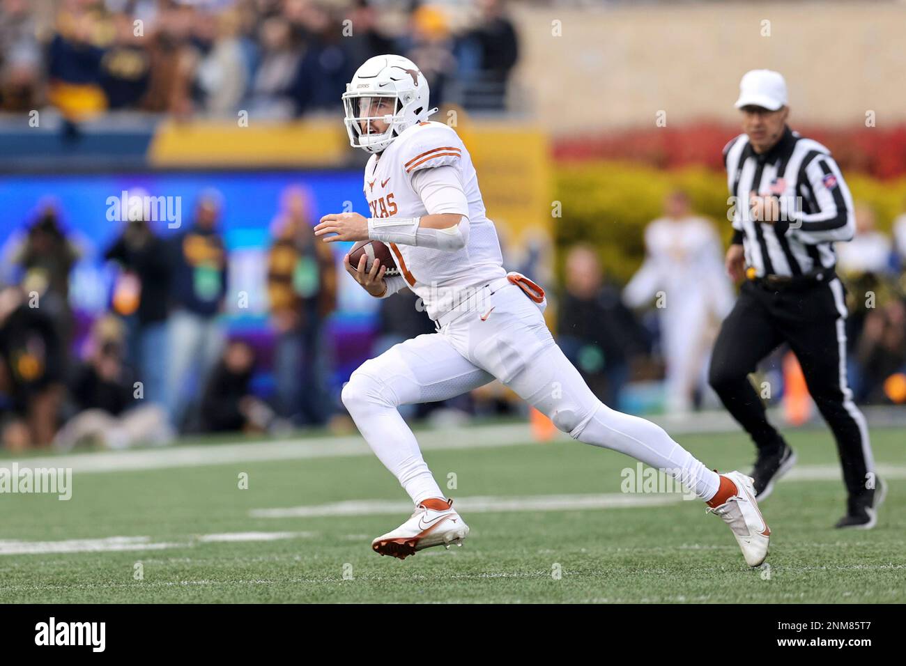 MORGANTOWN, WV - NOVEMBER 20: Texas Longhorns quarterback Hudson Card (1) runs the football ...