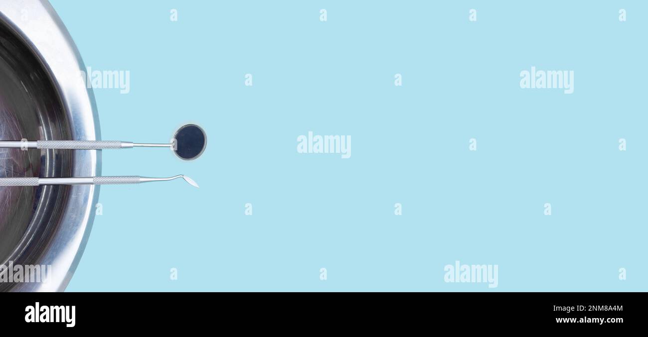 Basic dentist tools , toothbrush, toothpaste and Tooth model on blue ...