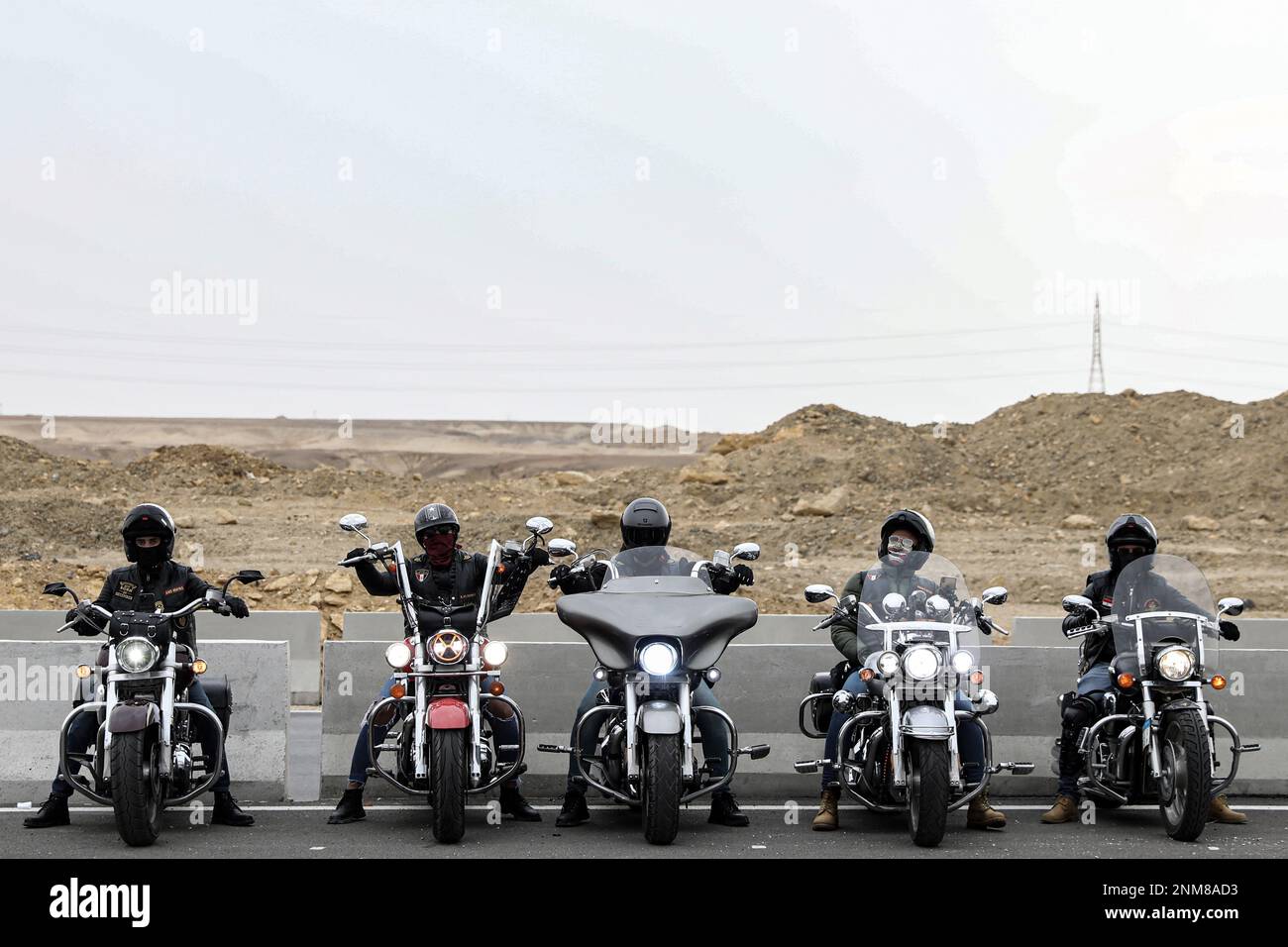 Cairo, Egypt. 24th Feb, 2023. Members of the motorcycle group "Commanders MC" ride their ...