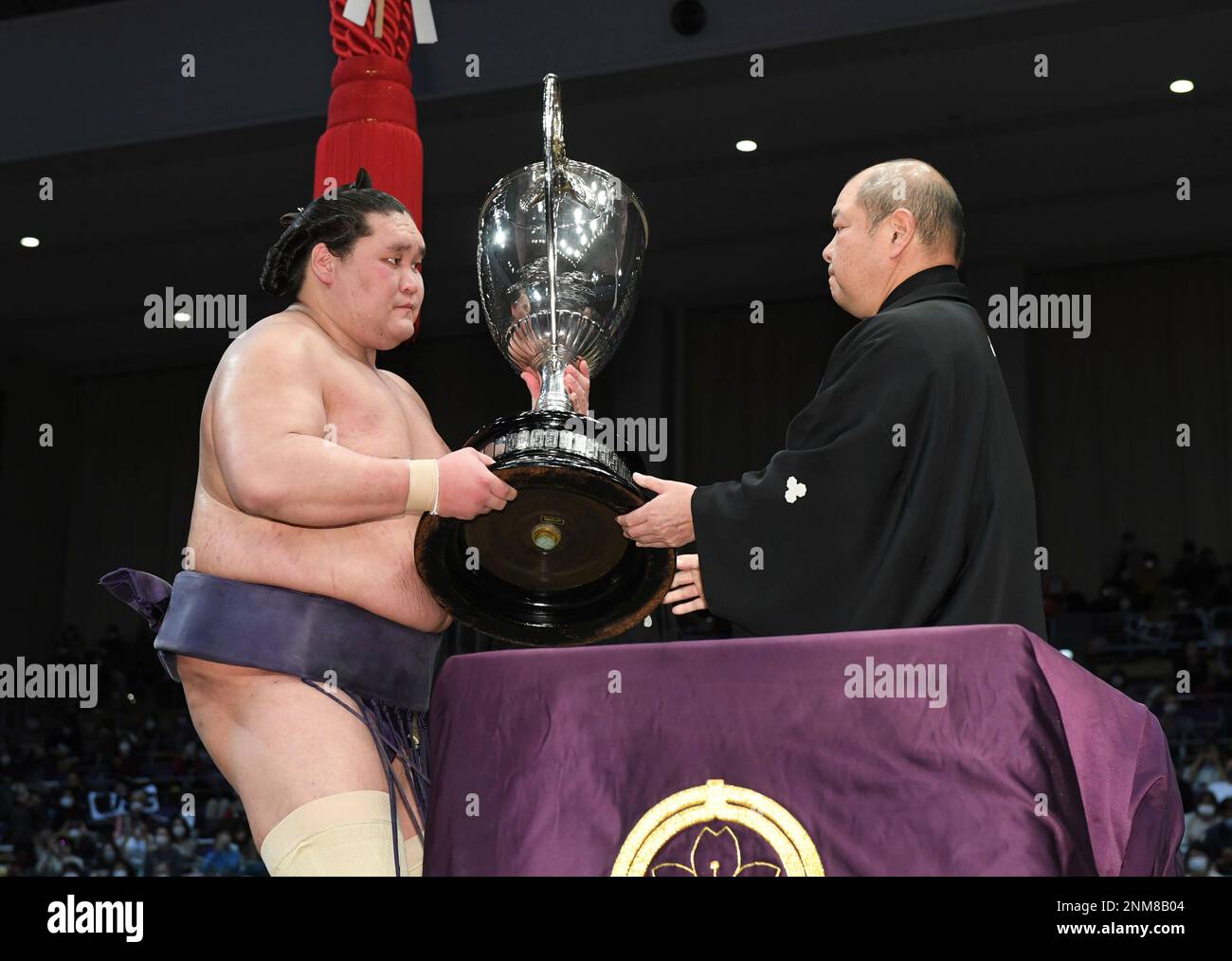 Mongolian Yokozuna Terunofuji receives the trophy after winning the ...