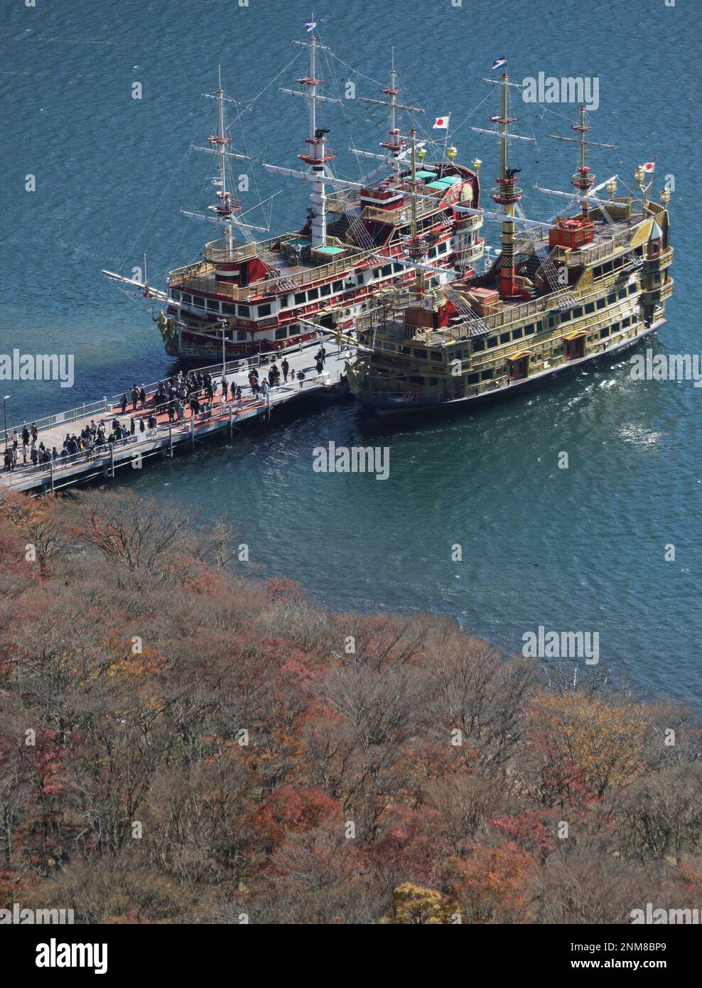 An aerial photo shows cruise ships on Ashinoko Lake in Hakone Town ...