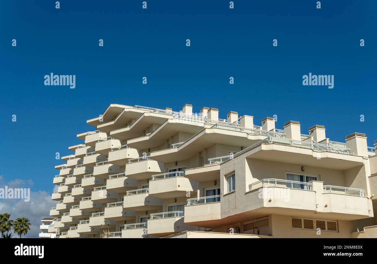 Sa Coma, Spain; february 17 2023: Main facade of a white hotel a sunny ...