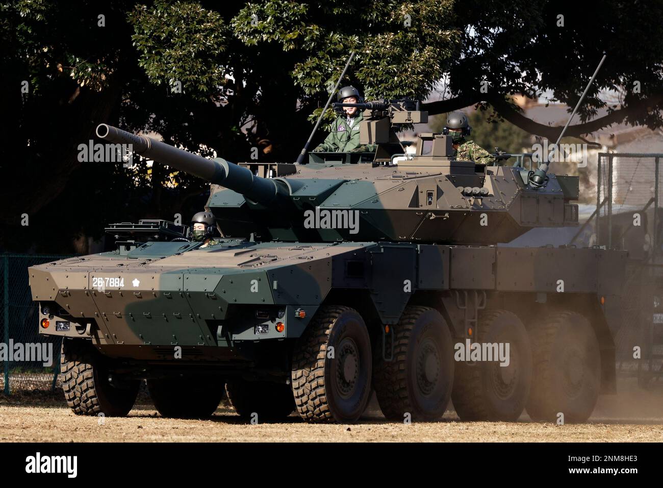 Japan's Prime Minister Fumio Kishida, left, rides on a Japan Ground ...