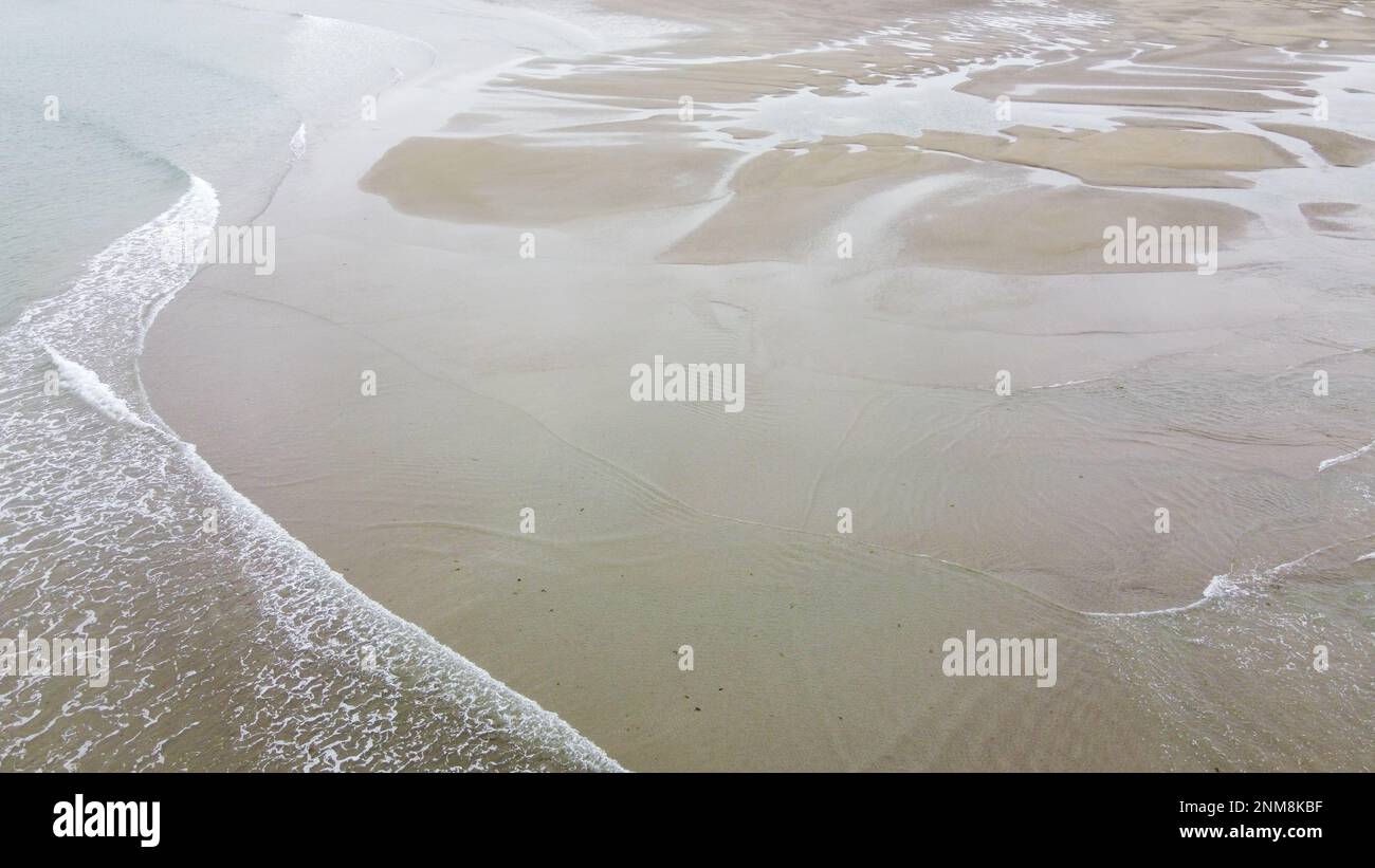 Sandy shore. Minimalistic seascape, a copy space. Wet sand. Natural ...