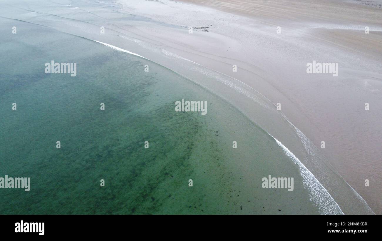 Sandy seashore, top view. Minimalistic seascape, a copy space. Wet sand ...