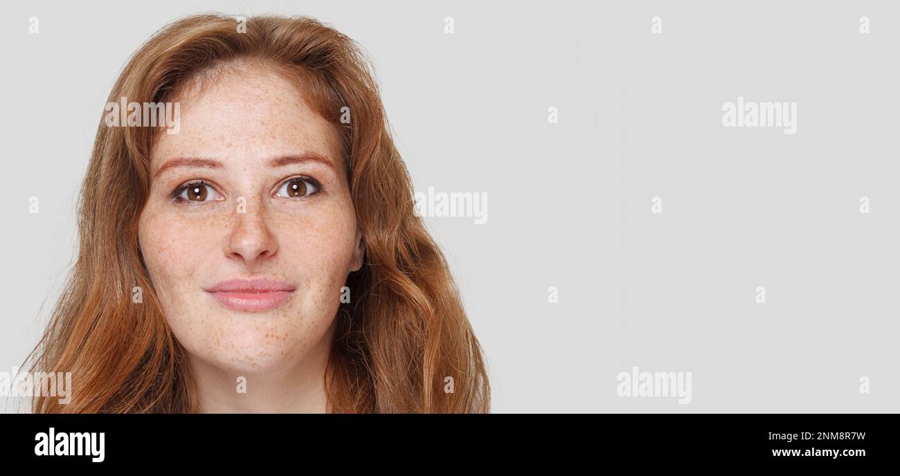 Pretty real young redhead woman, beautiful face closeup portrait ...