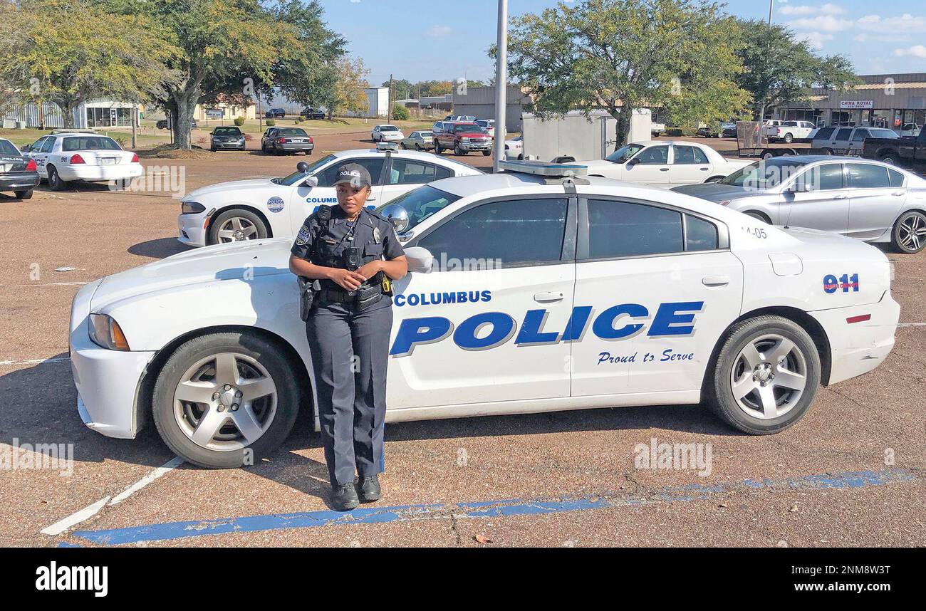 Officer Johannah Owusu, 23, stands with her patrol unit outside ...