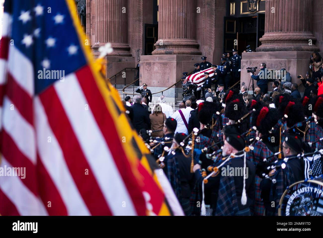 A honor guard carries the casket containing the remains of Temple ...