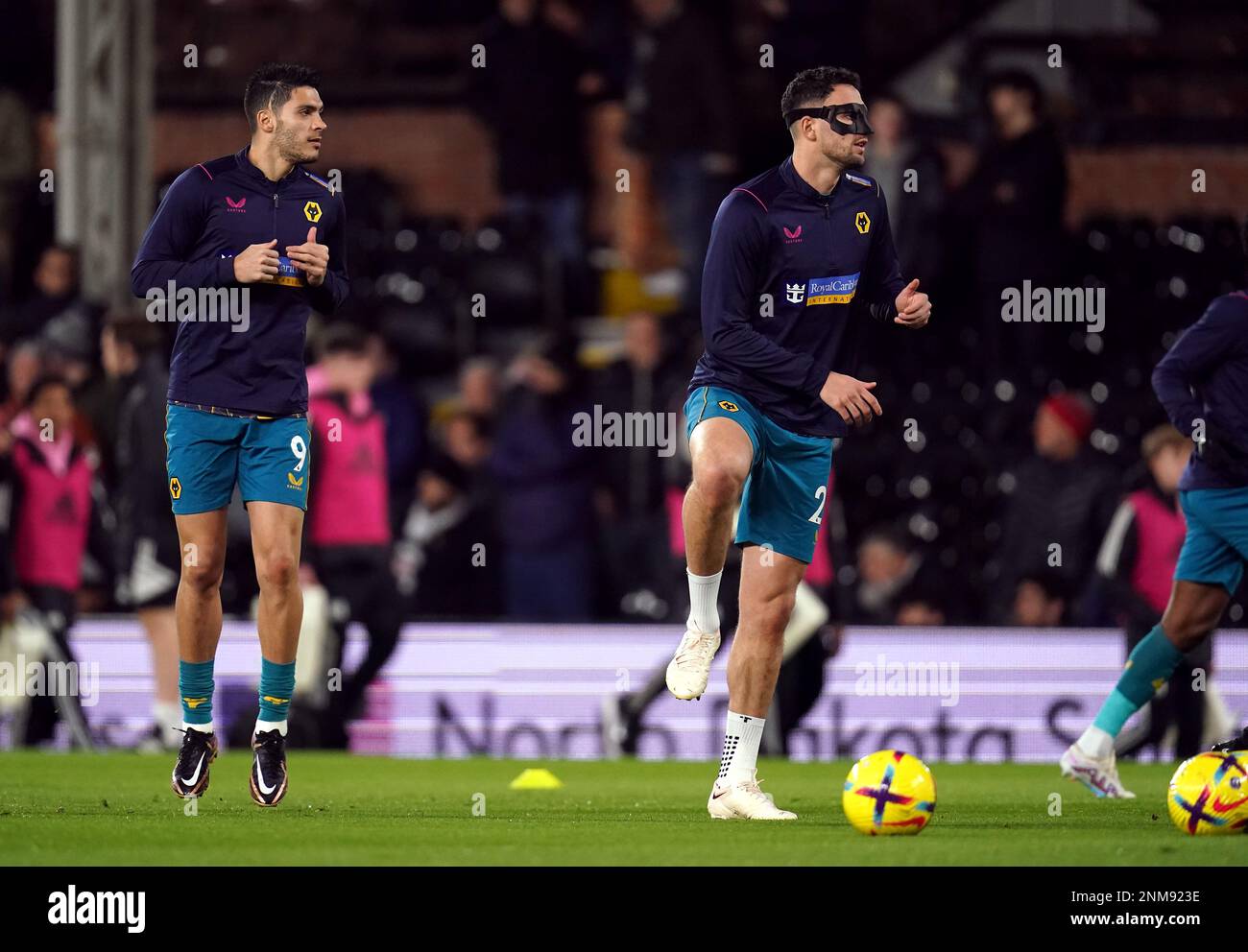 Wolverhampton Wanderers' Raul Jimenez and Max Kilman (right) warm up ...