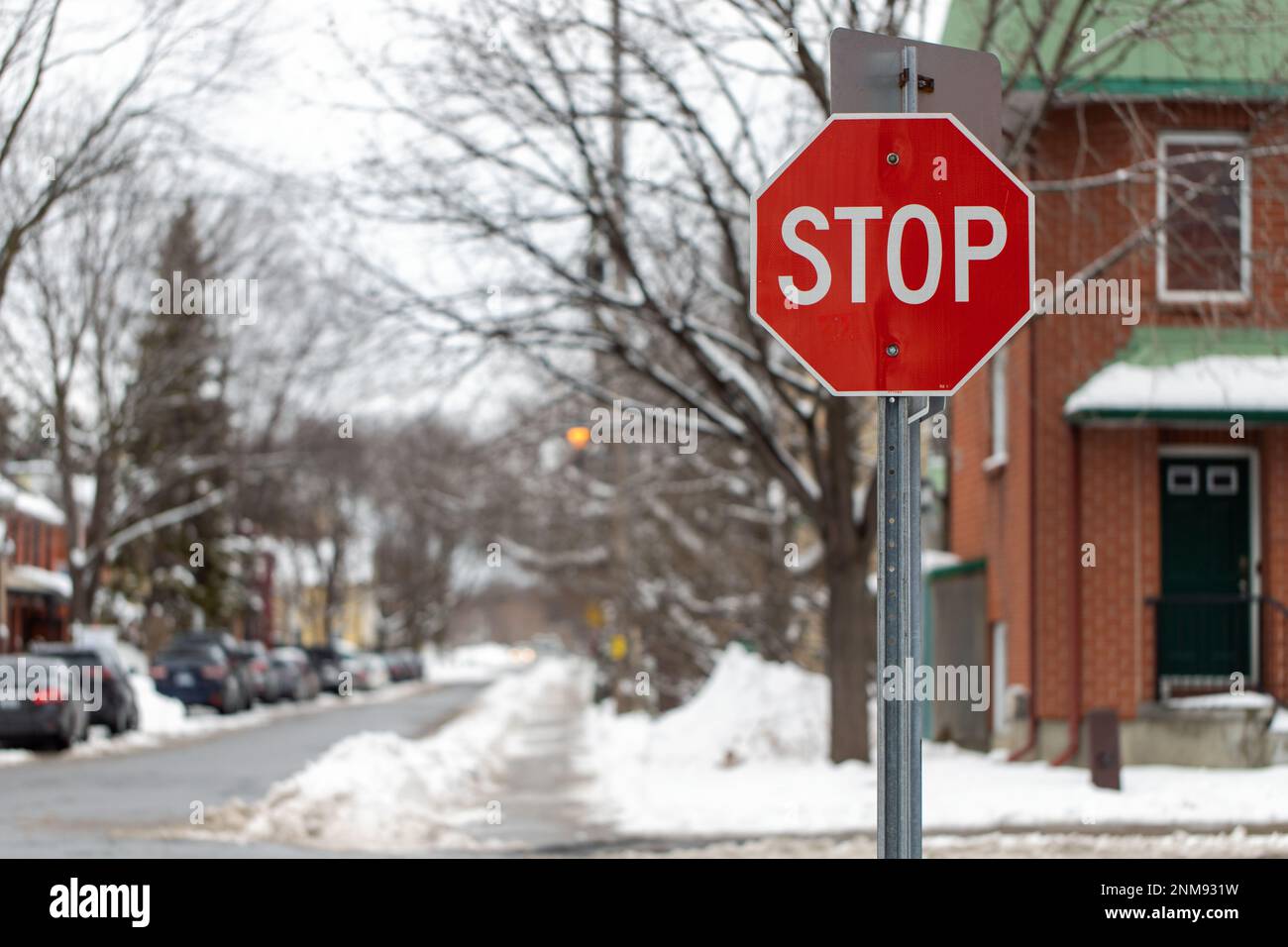 Stop sign in a residential neighborhood at crossroads in winter Stock ...