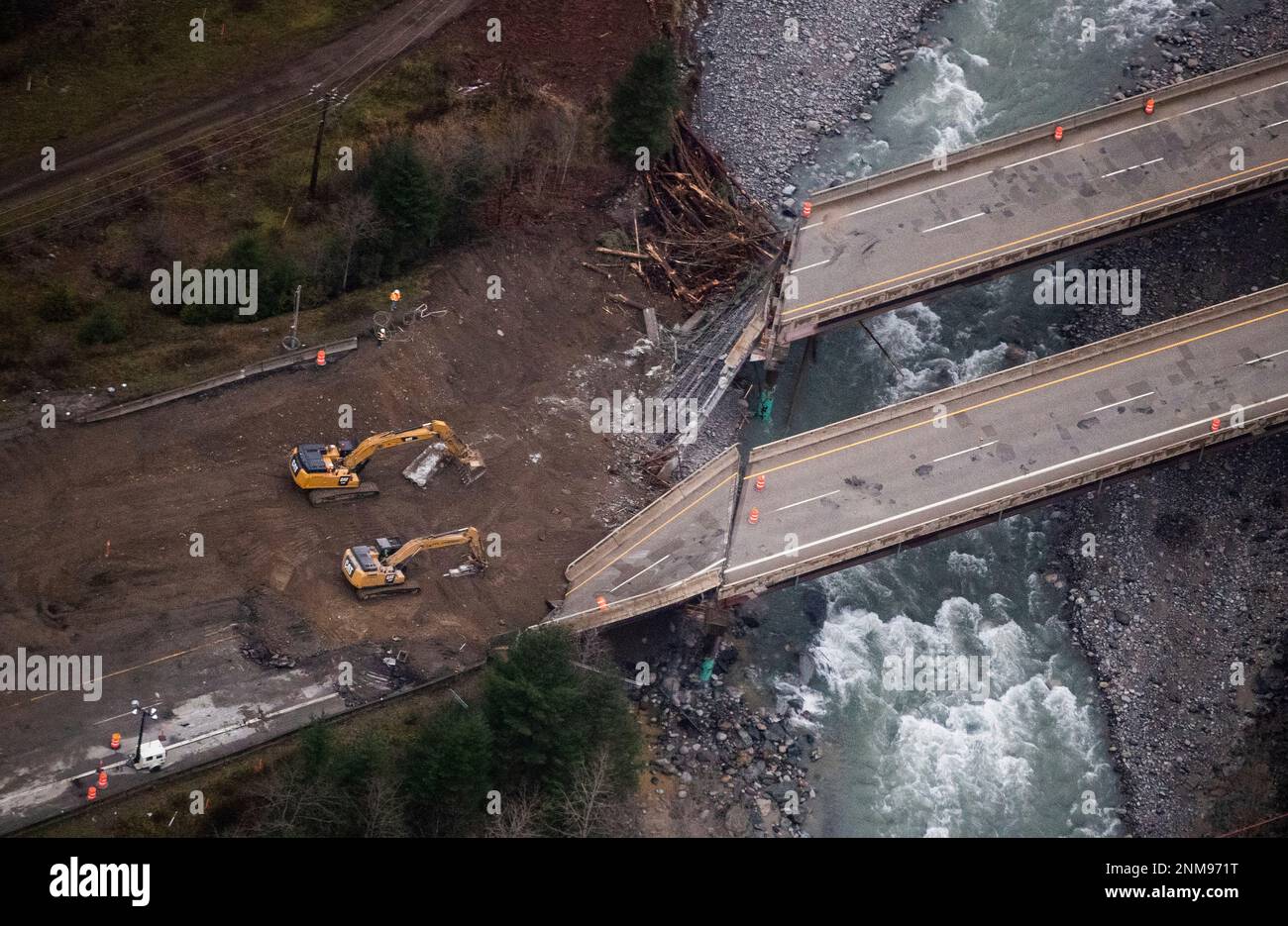 Collapsed sections of bridges destroyed by severe flooding and ...