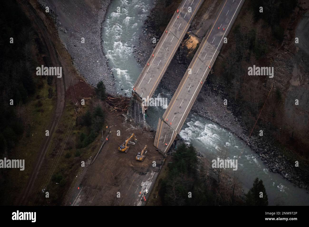 Collapsed sections of bridges destroyed by severe flooding and ...