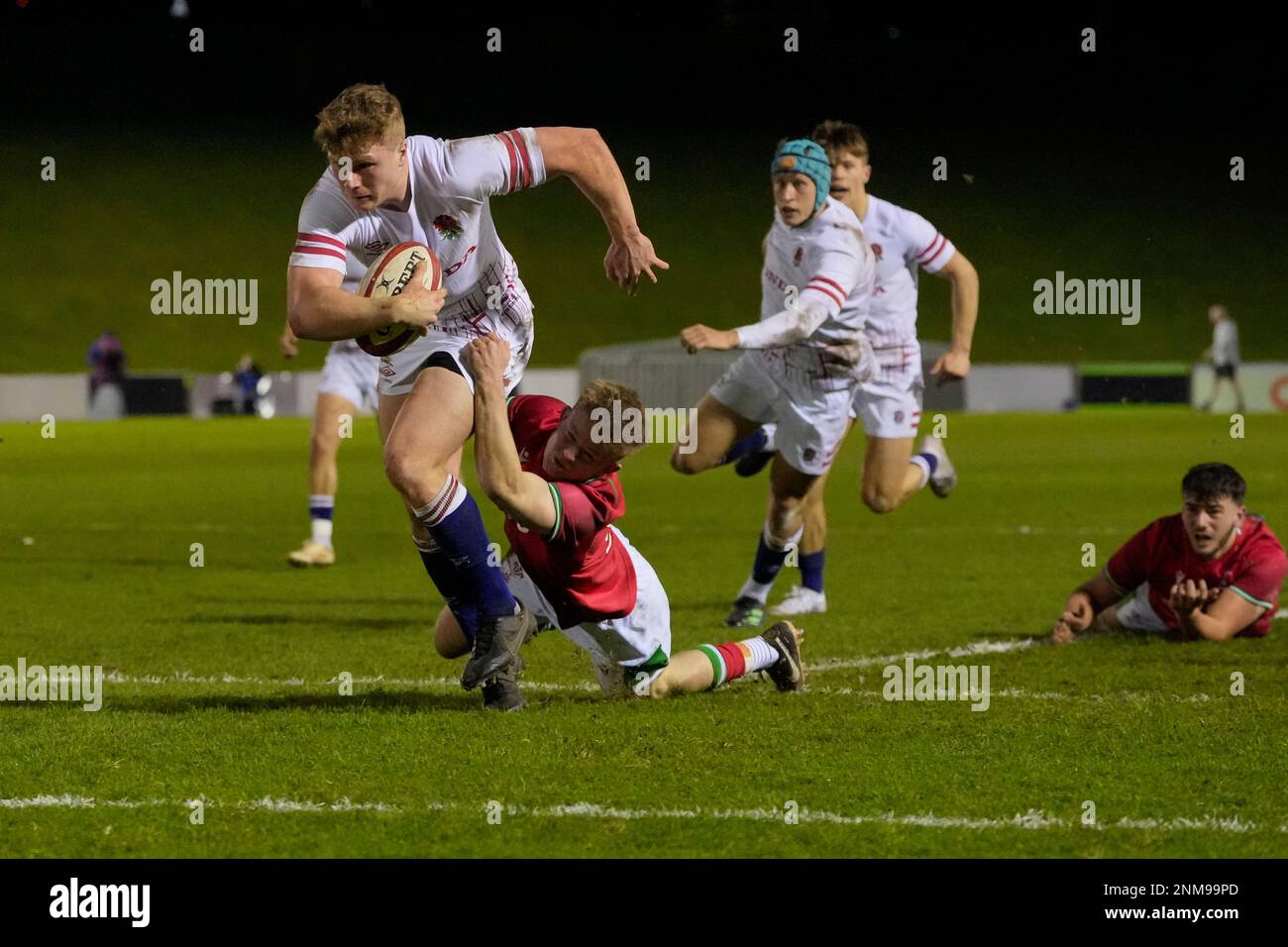 Joe Woodward of England U20's breaks a tackle on the way to scoring a ...