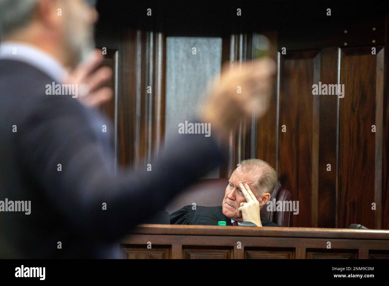 Superior Court Judge Timothy Walmsley listens to defense attorney Jason ...