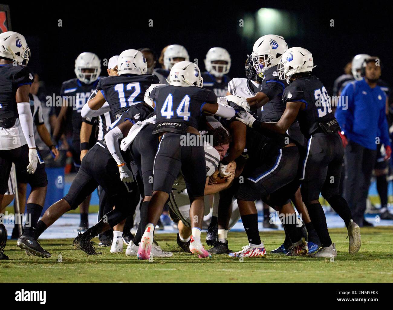 St. Frances Academy Panthers quarterback John Griffith (13) is gang ...
