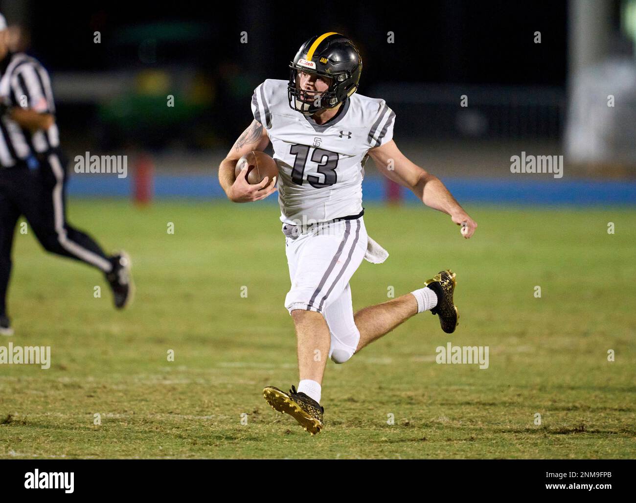 St. Frances Academy Panthers quarterback John Griffith (13) scrambles ...