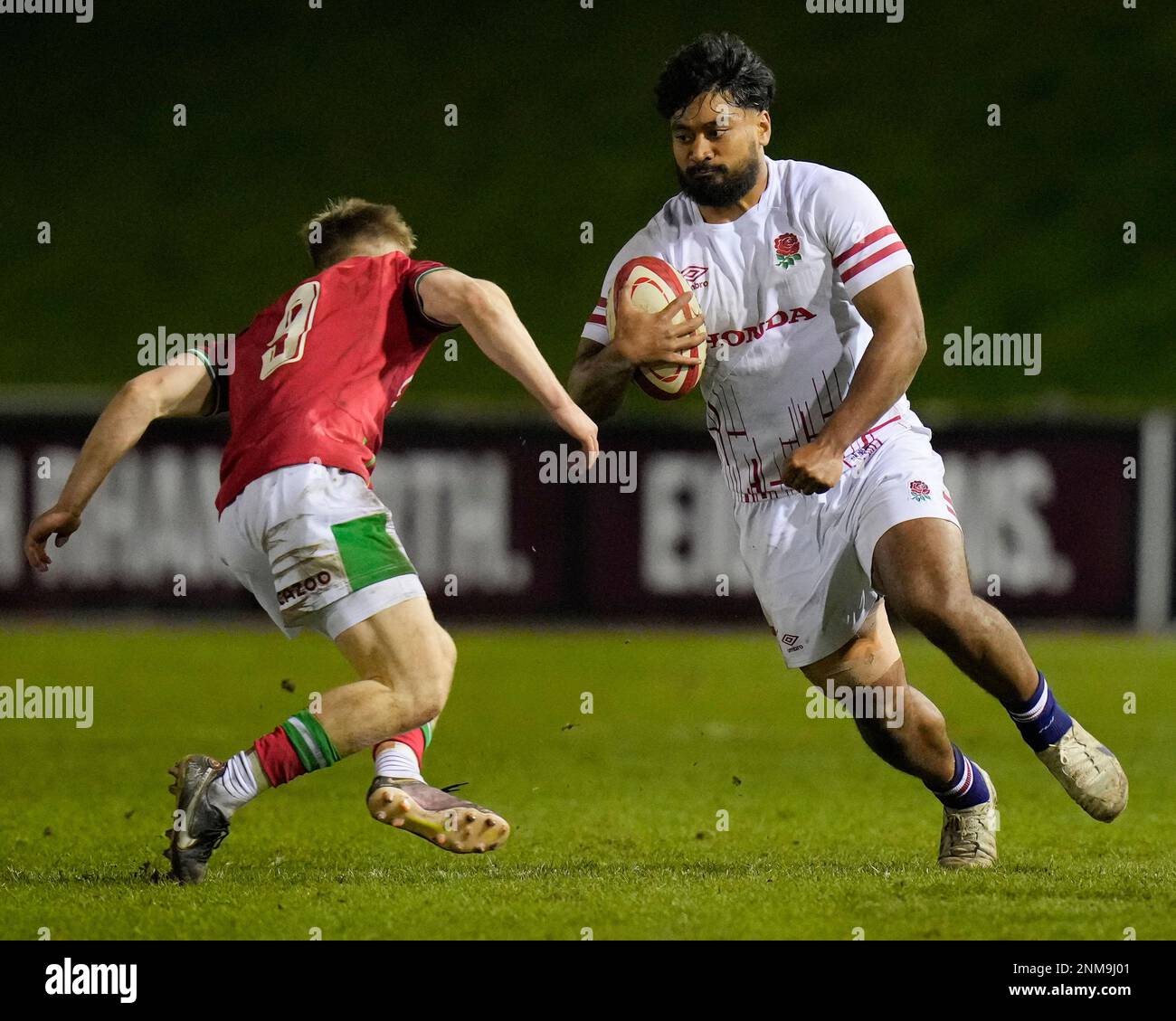 Rekeiti Ma'asi-White of England U20's runs at Archie Hughes #9 of Wales ...