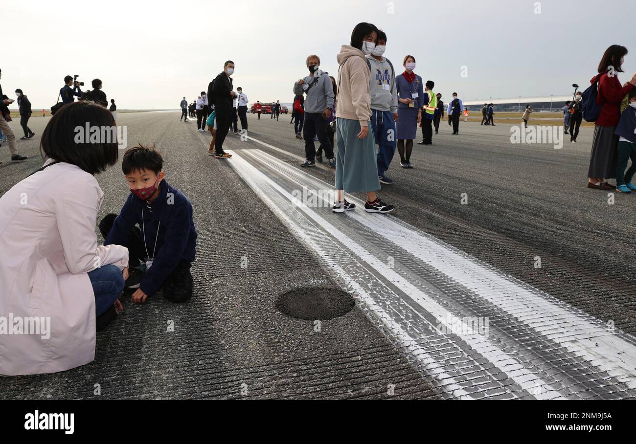 Participants walk on Runway A during an event "KIX Runway Walk" at ...