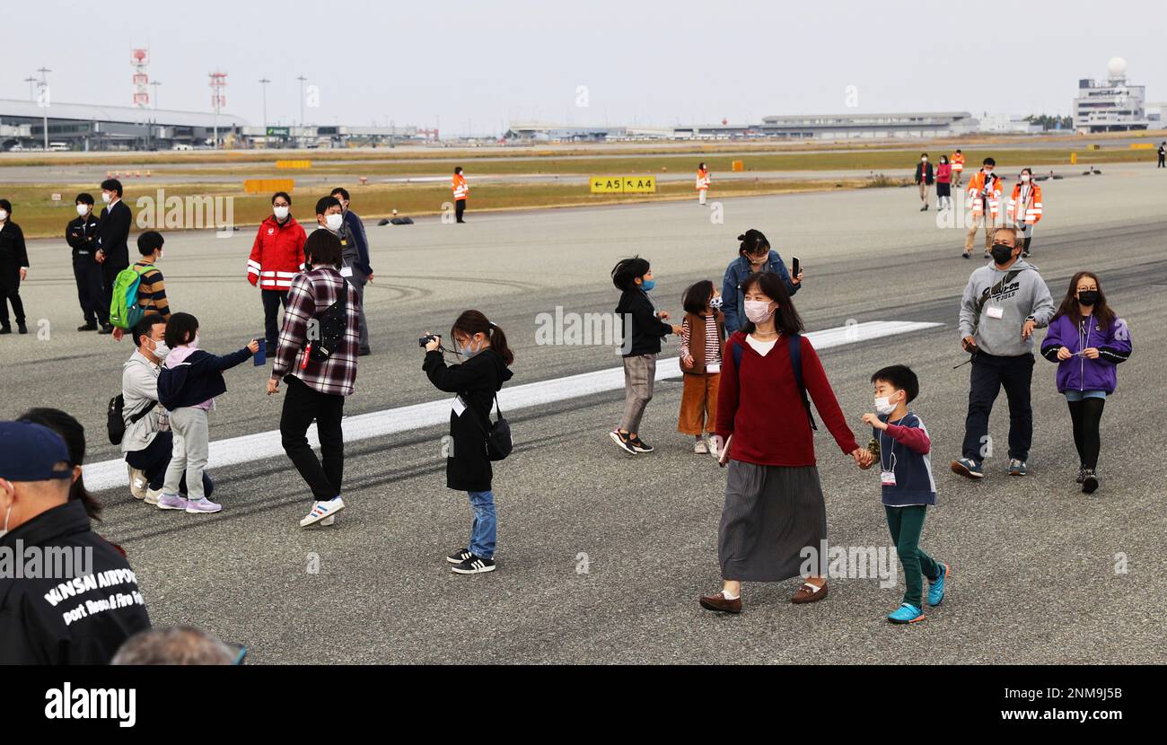 Participants walk on Runway A during an event "KIX Runway Walk" at ...