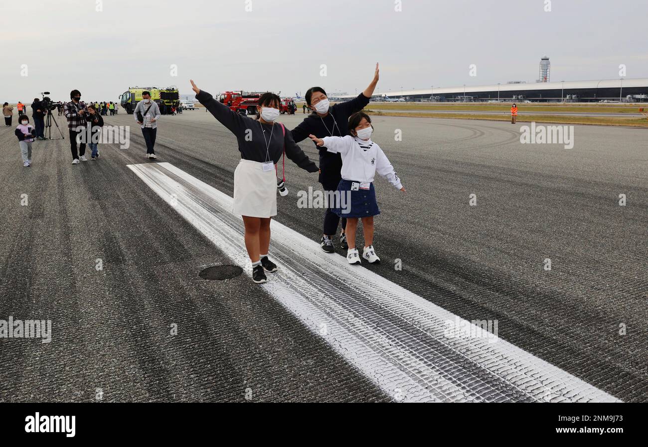 Participants walk on Runway A during an event "KIX Runway Walk" at ...