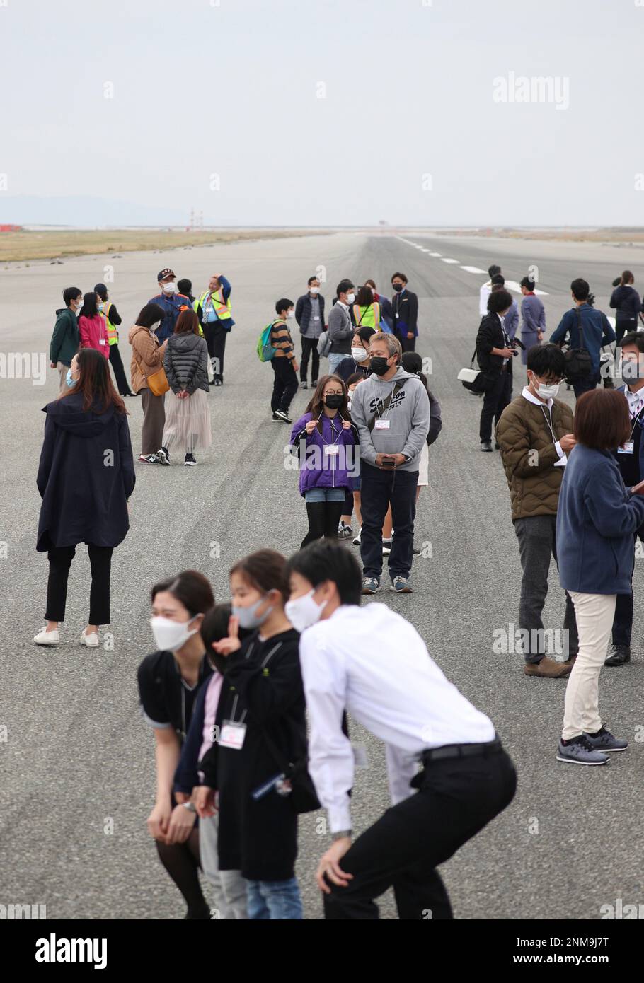Participants walk on Runway A during an event "KIX Runway Walk" at ...