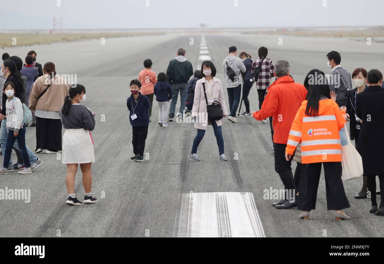 Participants walk on Runway A during an event "KIX Runway Walk" at ...
