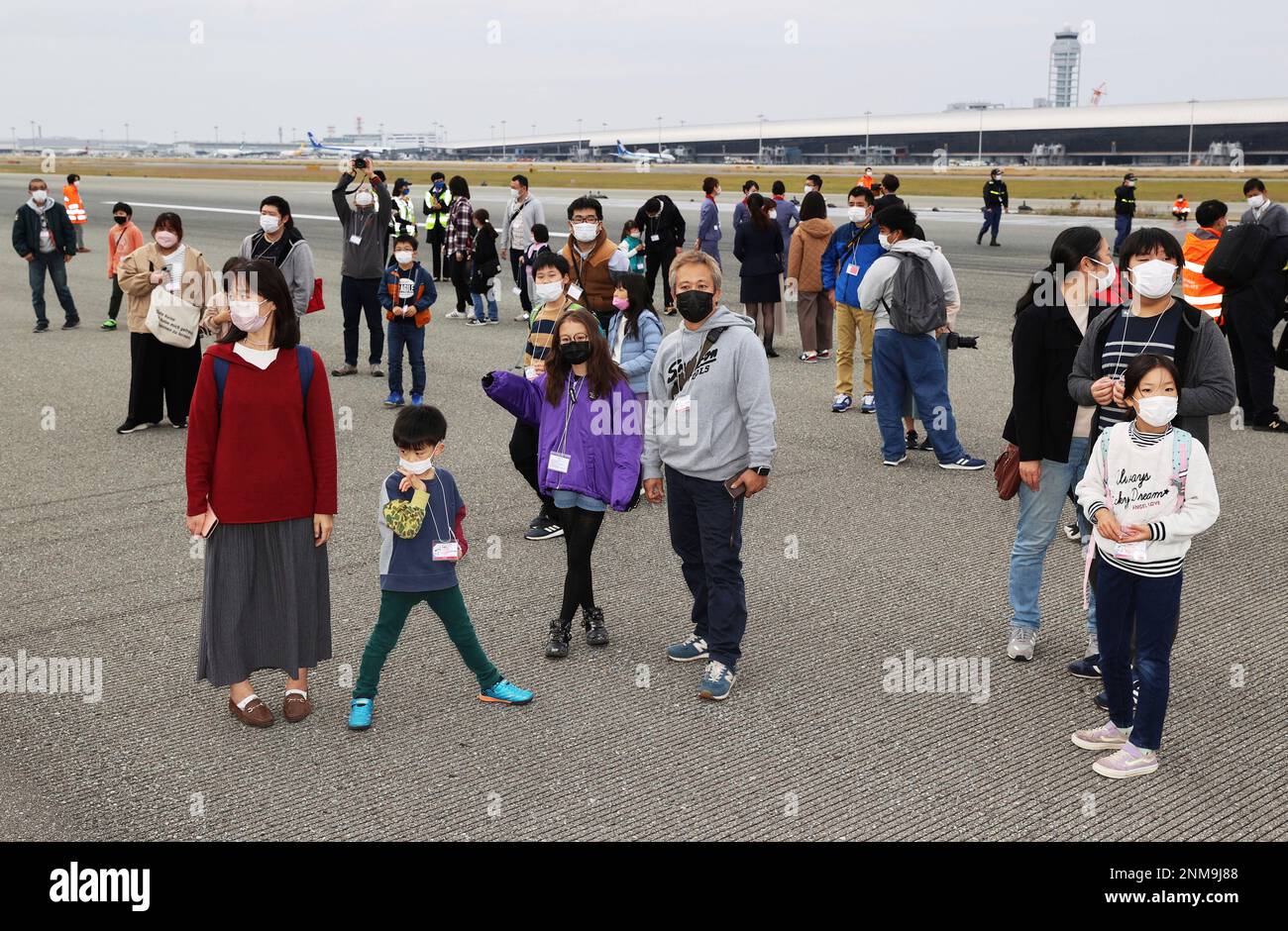 Participants walk on Runway A during an event "KIX Runway Walk" at ...
