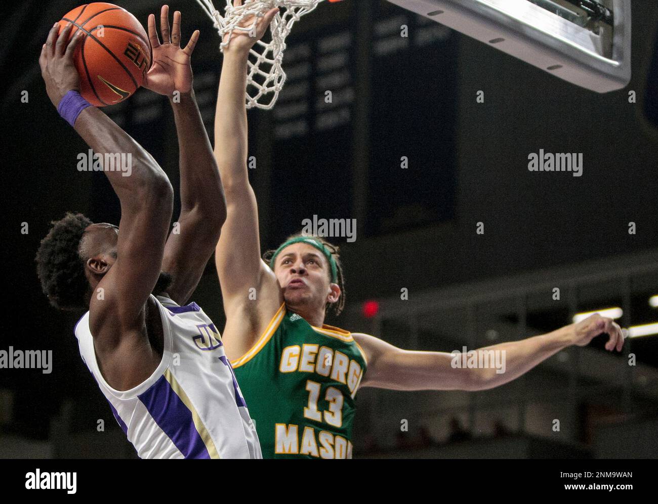 James Madison forward Alonzo Sule (25) goes up for a shot against ...
