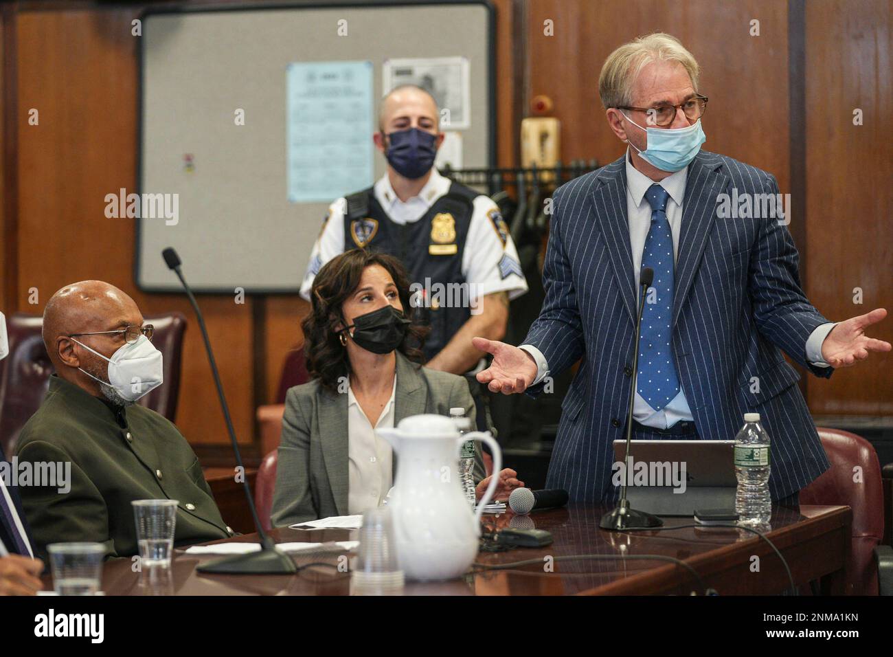 Muhammad Aziz , left, looks on as attorney Barry Scheck speaks in a ...
