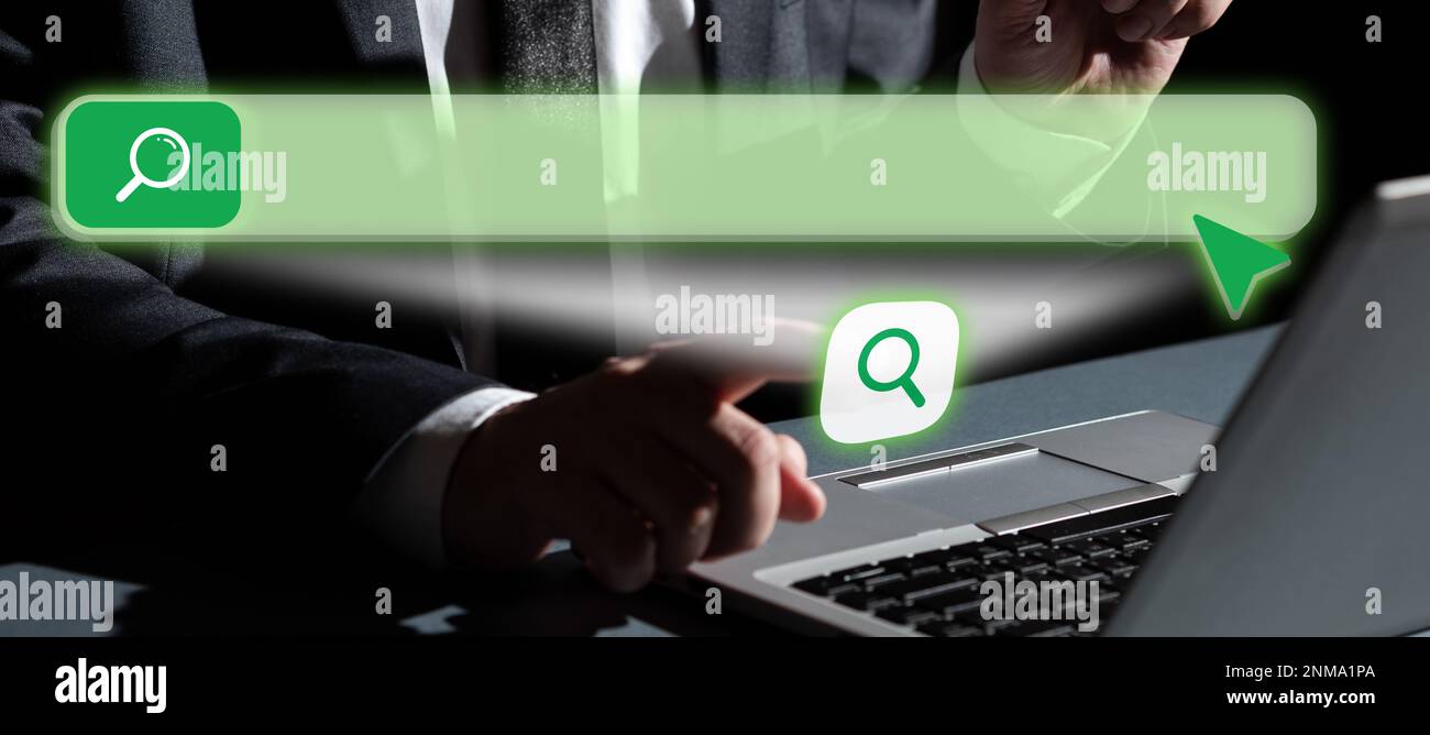 Businessman in office suit sitting at the table ant typing important ...