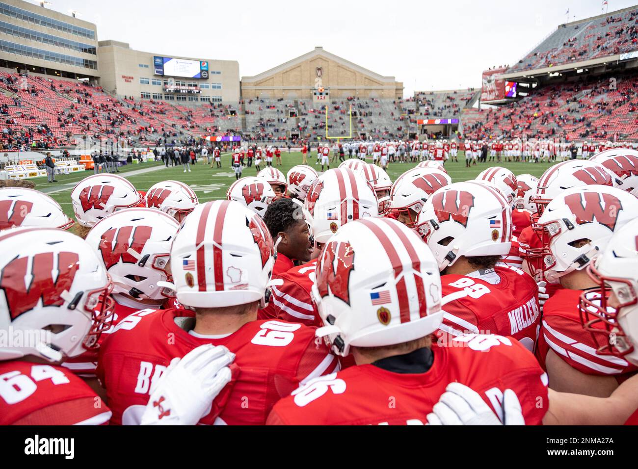 Wisconsin Badgers huddle prior to an NCAA college football game against ...