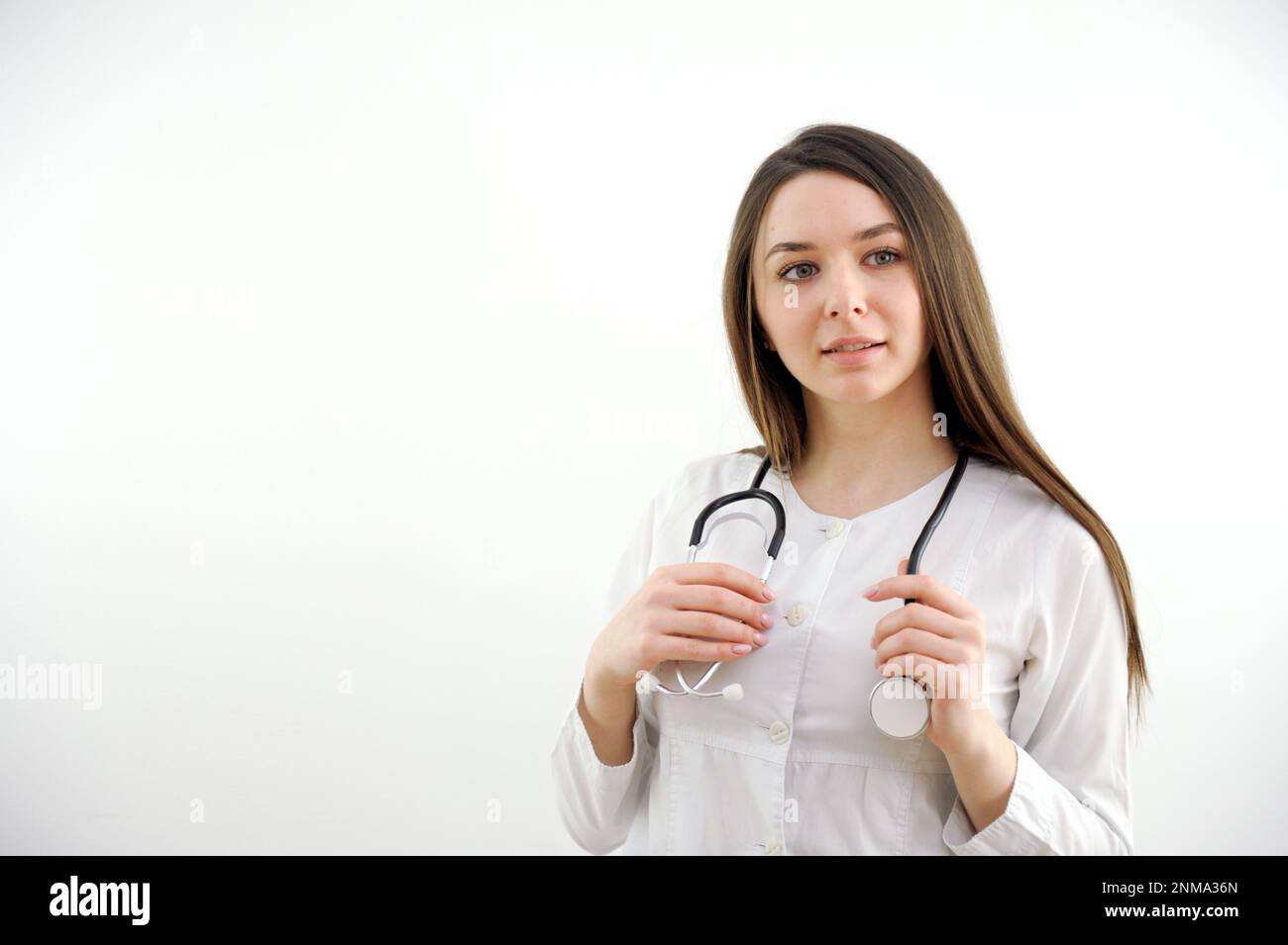 Photo of calm doctor lady hold equipment look side empty space wear ...
