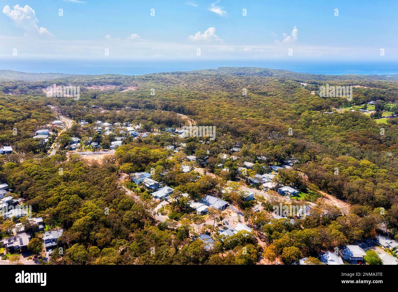 Distant pacific ocean from Lake Macquarie lakeshore resort town Murrays ...