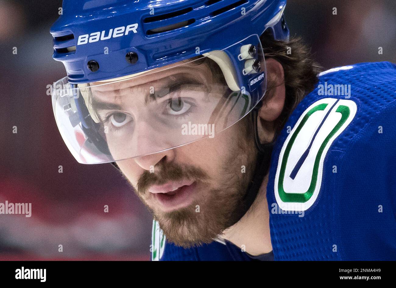 Vancouver Canucks' Conor Garland lines up for a faceoff during the ...