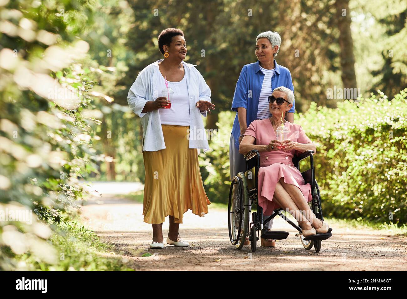 Woman enjoying a walk in the park hi-res stock photography and images ...