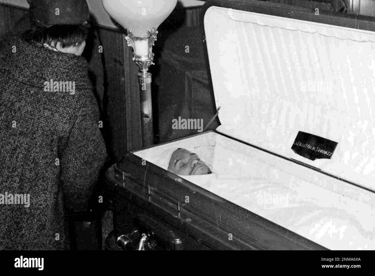 FILE — Malcolm X's widow, Betty Shabazz, looks at the body of her ...