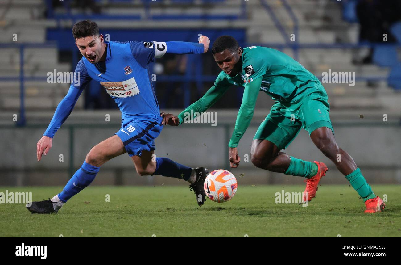 Dender's Lennard Hens and Virton's Keres Masangu fight for the ball ...